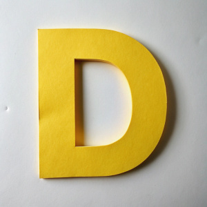 Letter D, cutout paper style, yellow color, no background - Recraft