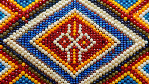 a detailed beadwork pattern with a central diamond motif, which is a ...