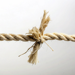 Frayed rope under tension symbolizing stress on white background - Recraft
