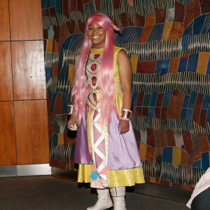 Jibril, a cheerful character with flowing pink hair and a vibrant ...